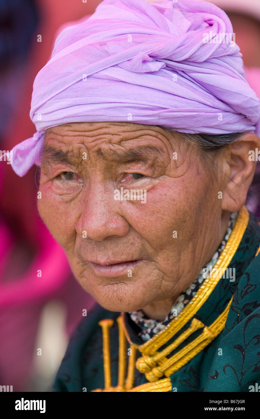 Traditionally dressed ethnic Mongolian attends summertime Naadam ...