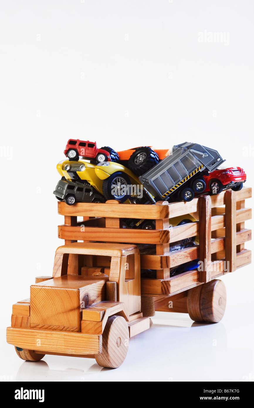 Miniature vehicles loaded into a toy truck Stock Photo - Alamy
