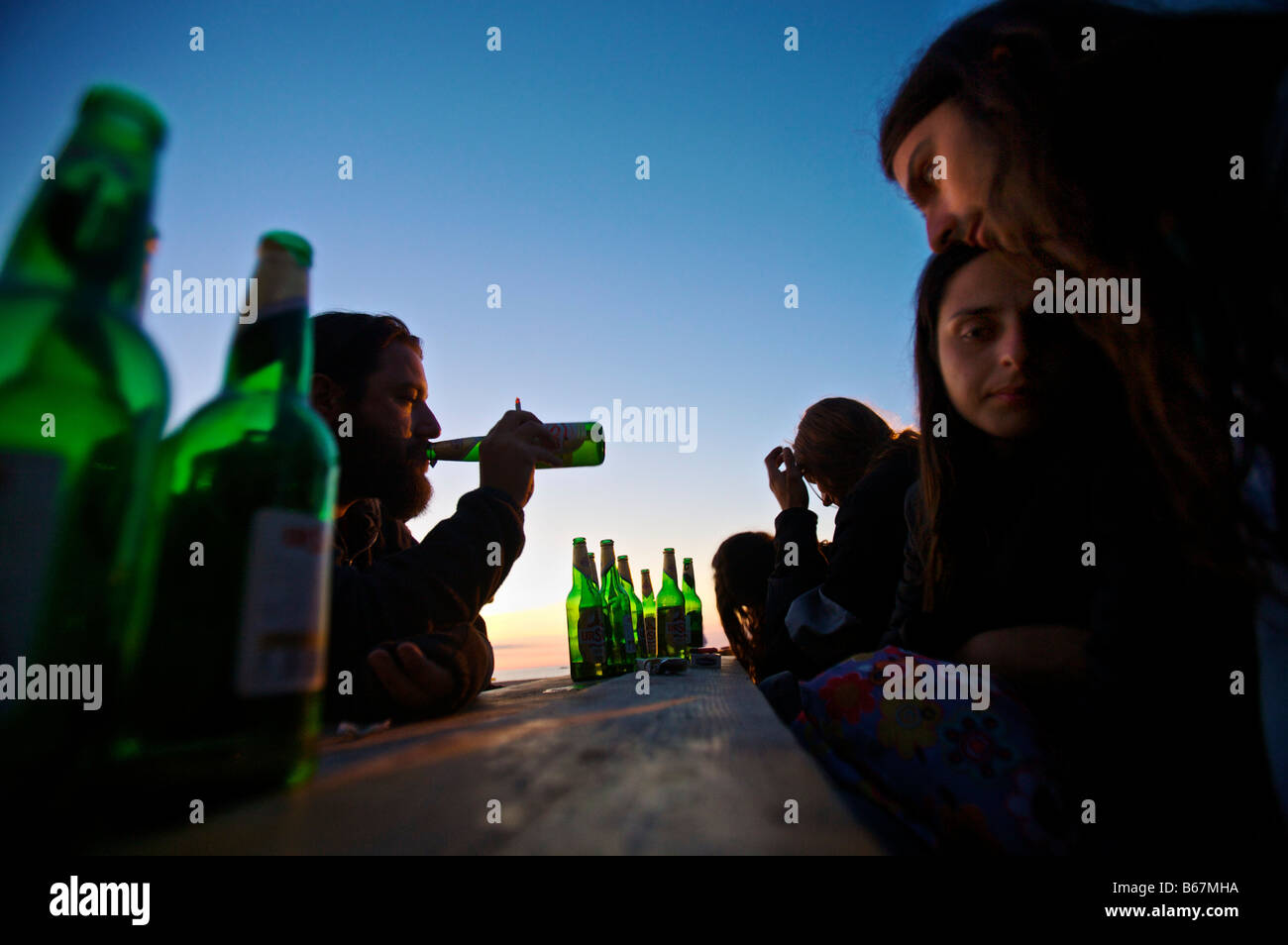 Group teens drinking alcohol outside hi-res stock photography and ...