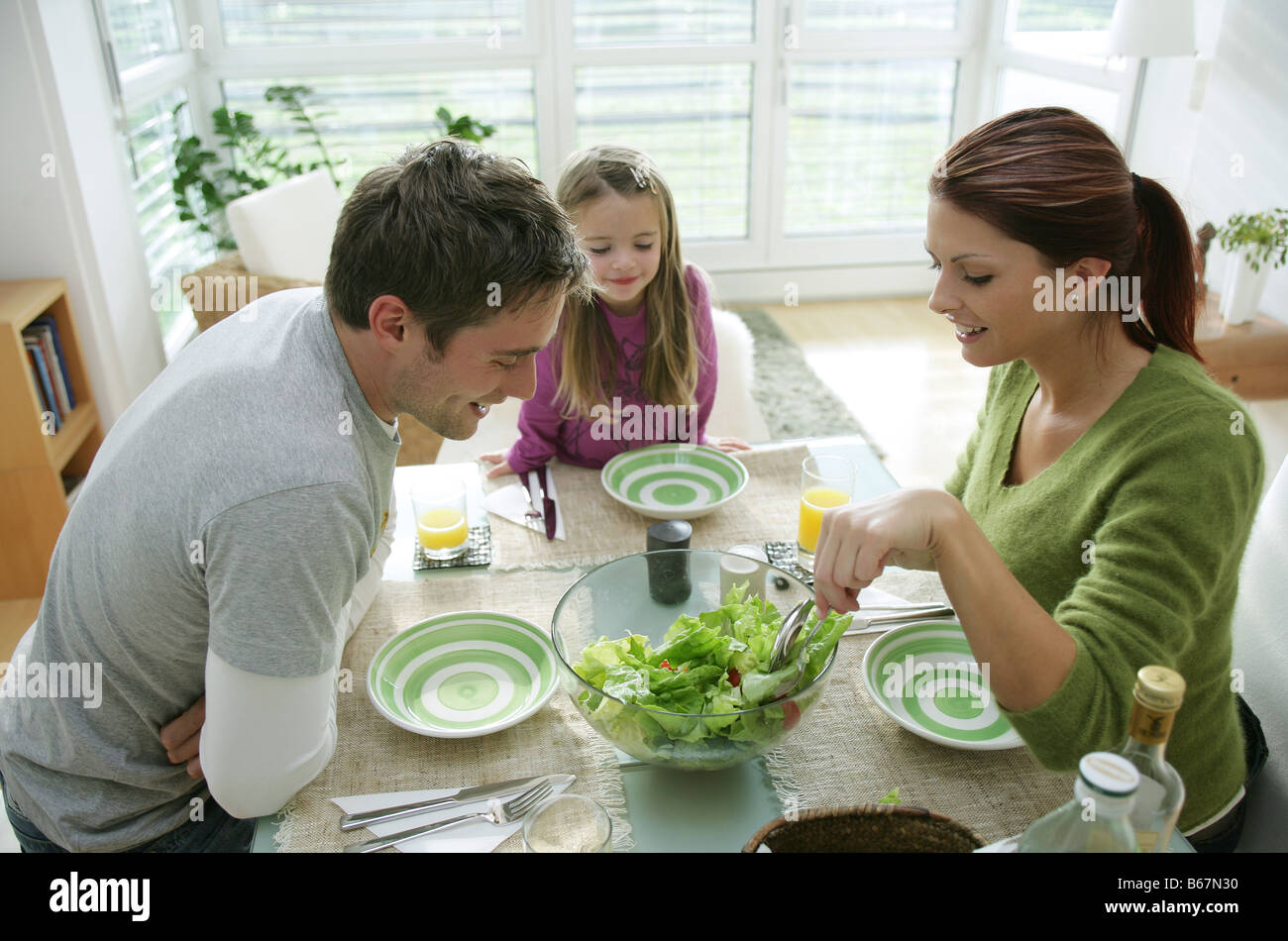 Young family having lunch, Munich, Germany Stock Photo - Alamy