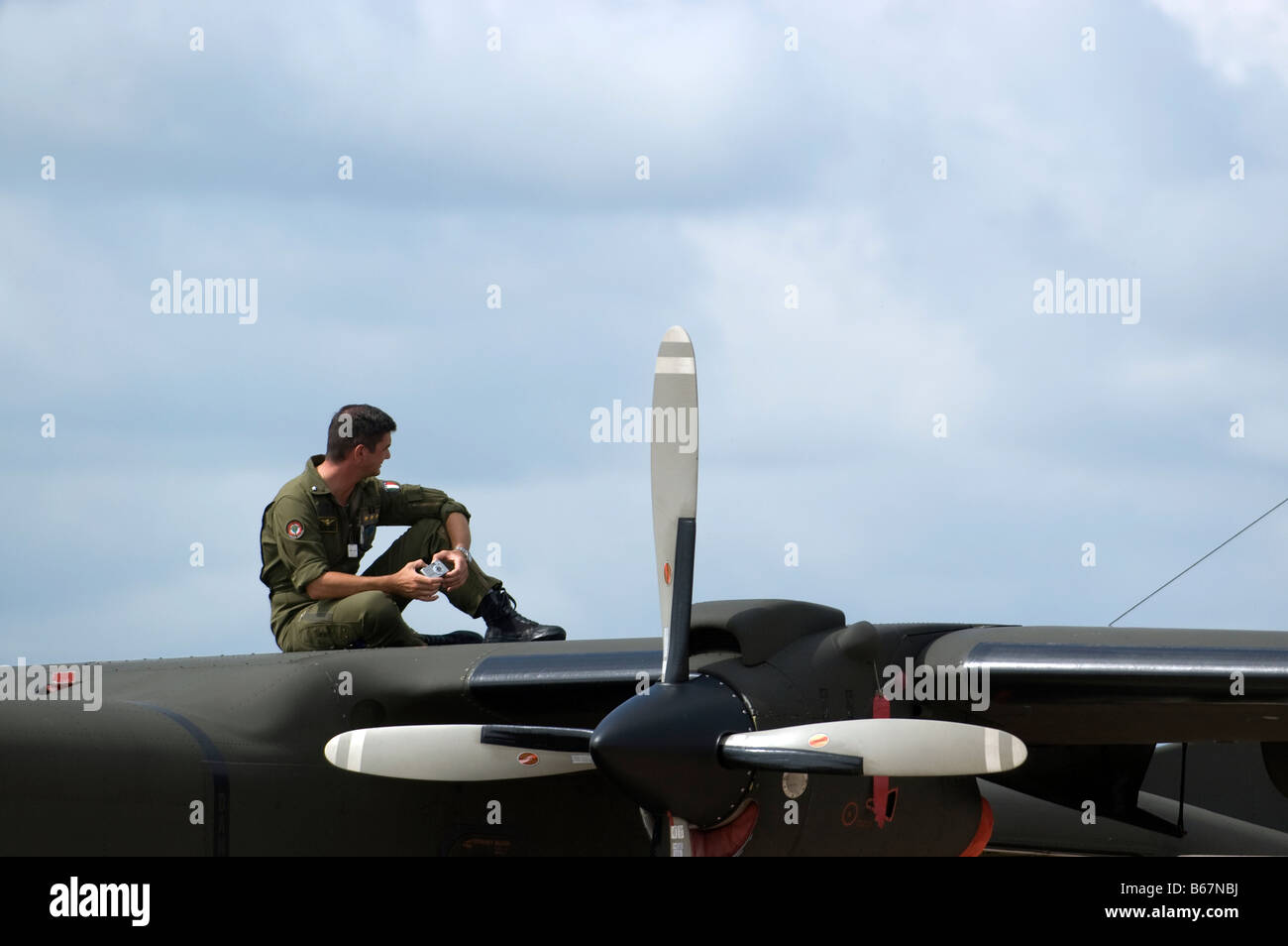 Man on top of wing of aircraft during airshow Stock Photo - Alamy