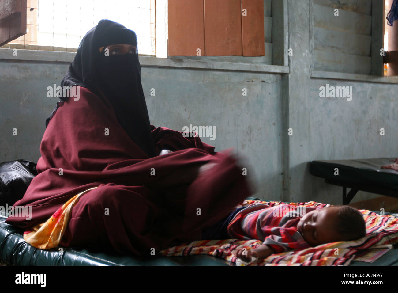 Undernourished somalian refugee boy with his mother in a hospital in ...