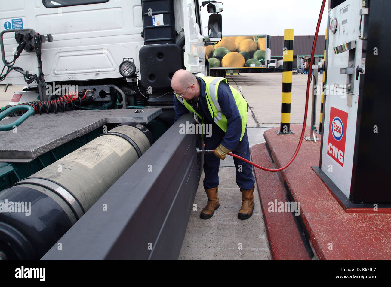 CNG pump with operator refuelling truck Stock Photo - Alamy