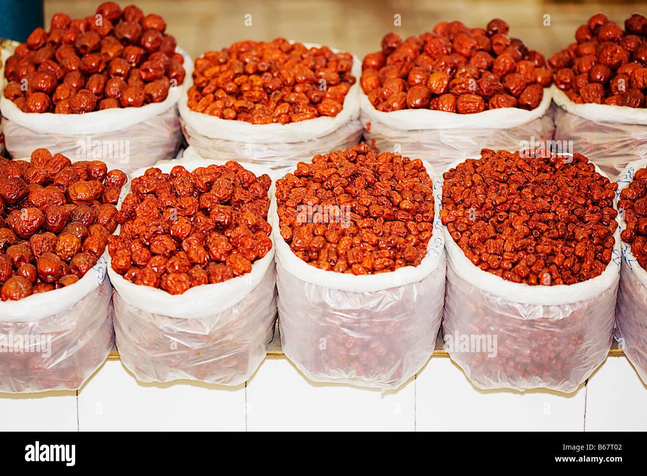 Sacks of dried berries at a market stall, Tai'an, Shandong Province ...