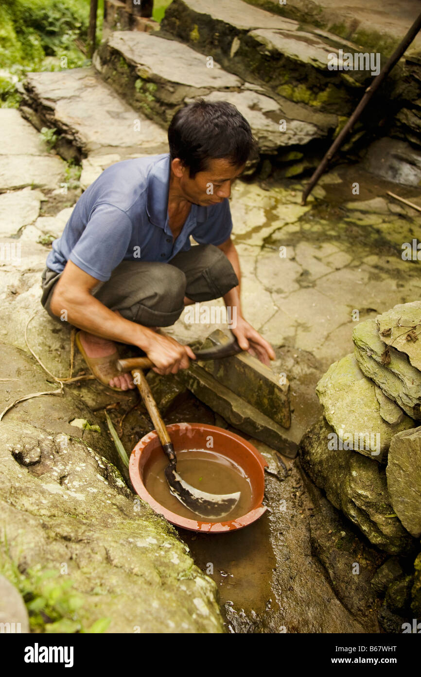 Man sharpening sickle hi-res stock photography and images - Alamy