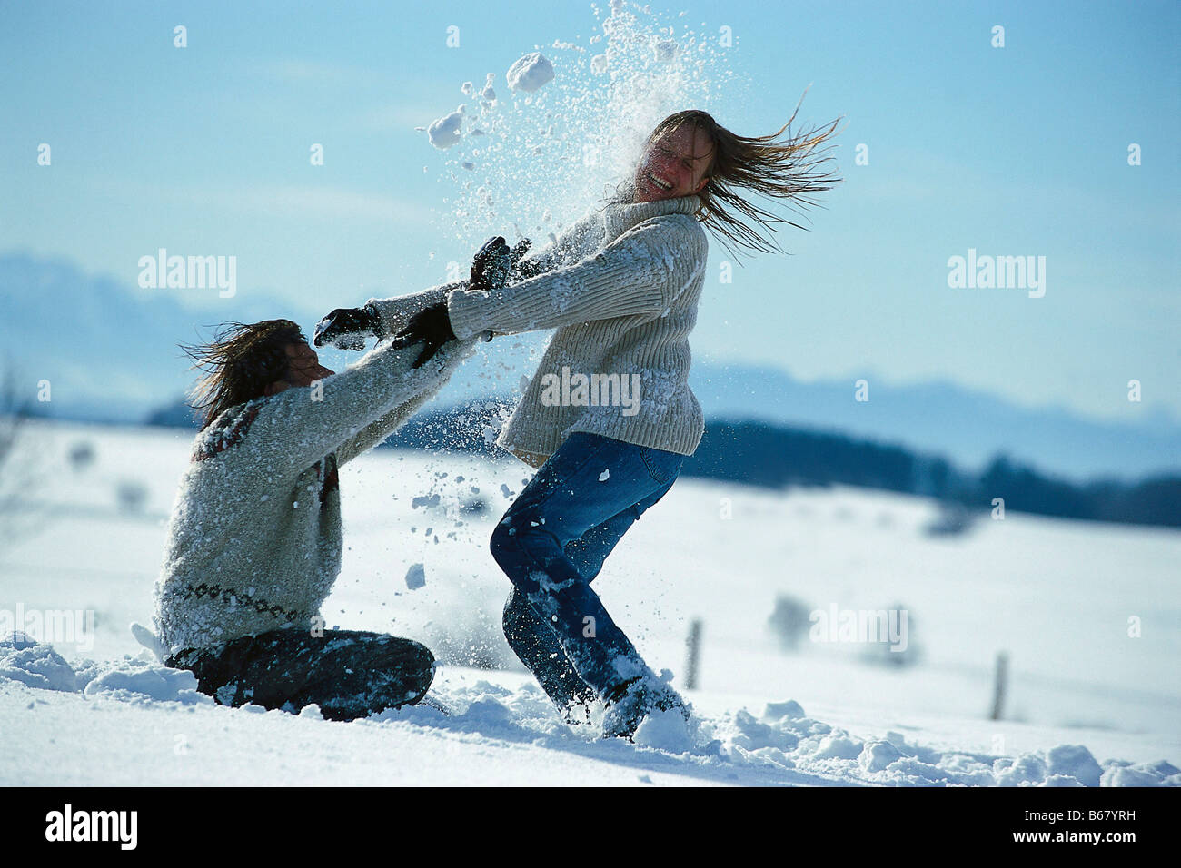 Couple having fun in the snow, Bavaria, Germany Stock Photo - Alamy