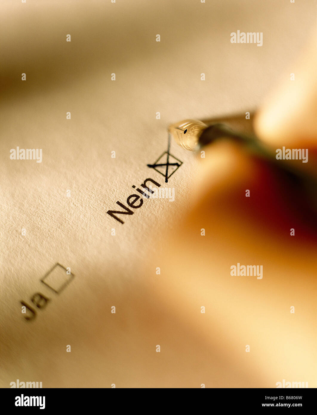 Hand with pen marking no on form Stock Photo - Alamy