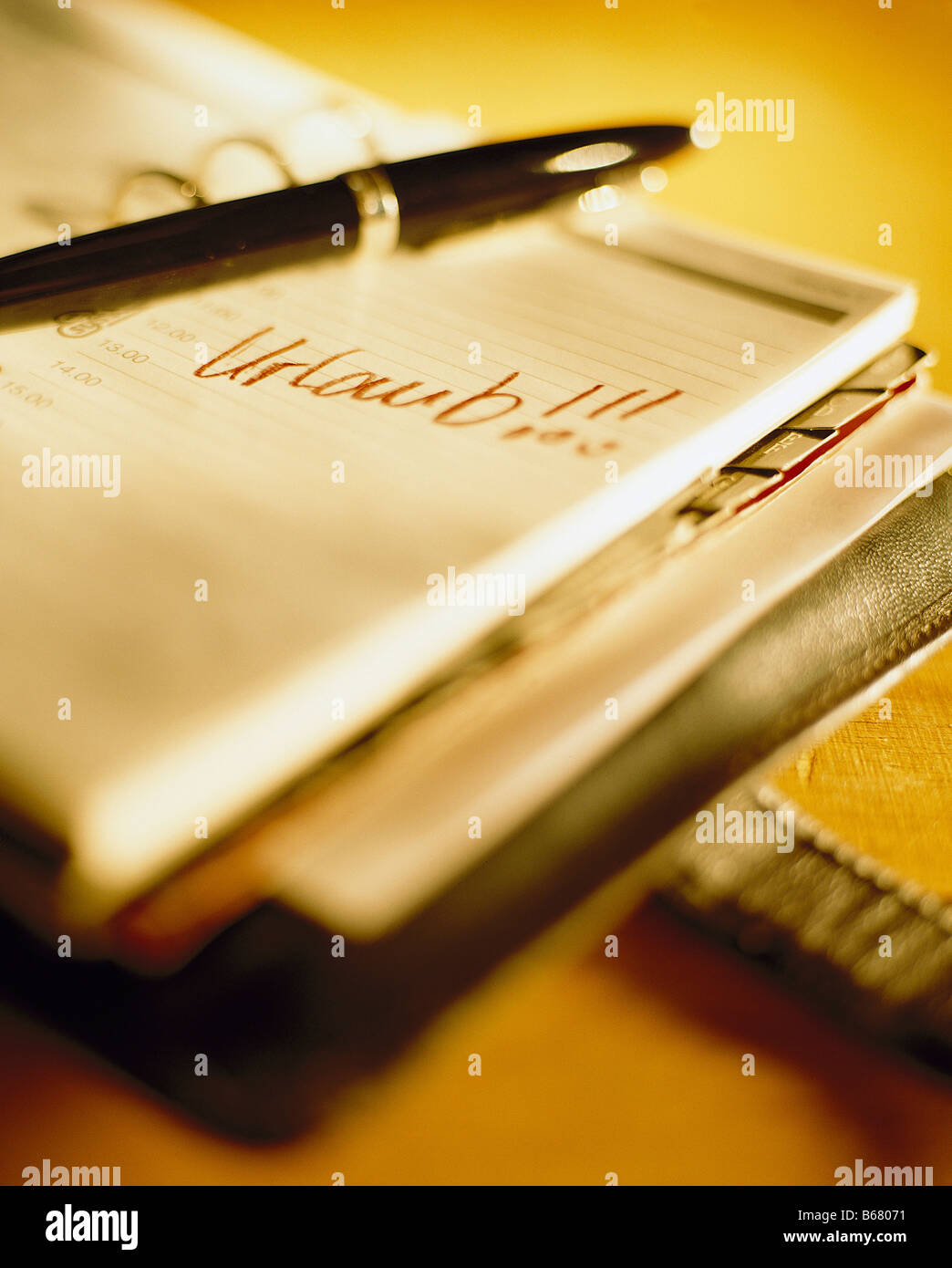 Writing holiday on personal organizer Stock Photo - Alamy