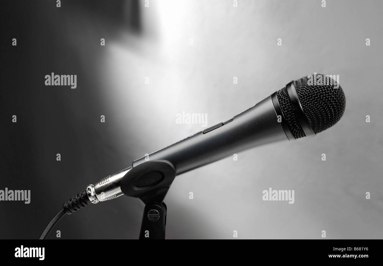 Microphone on stand against neutral background Stock Photo - Alamy