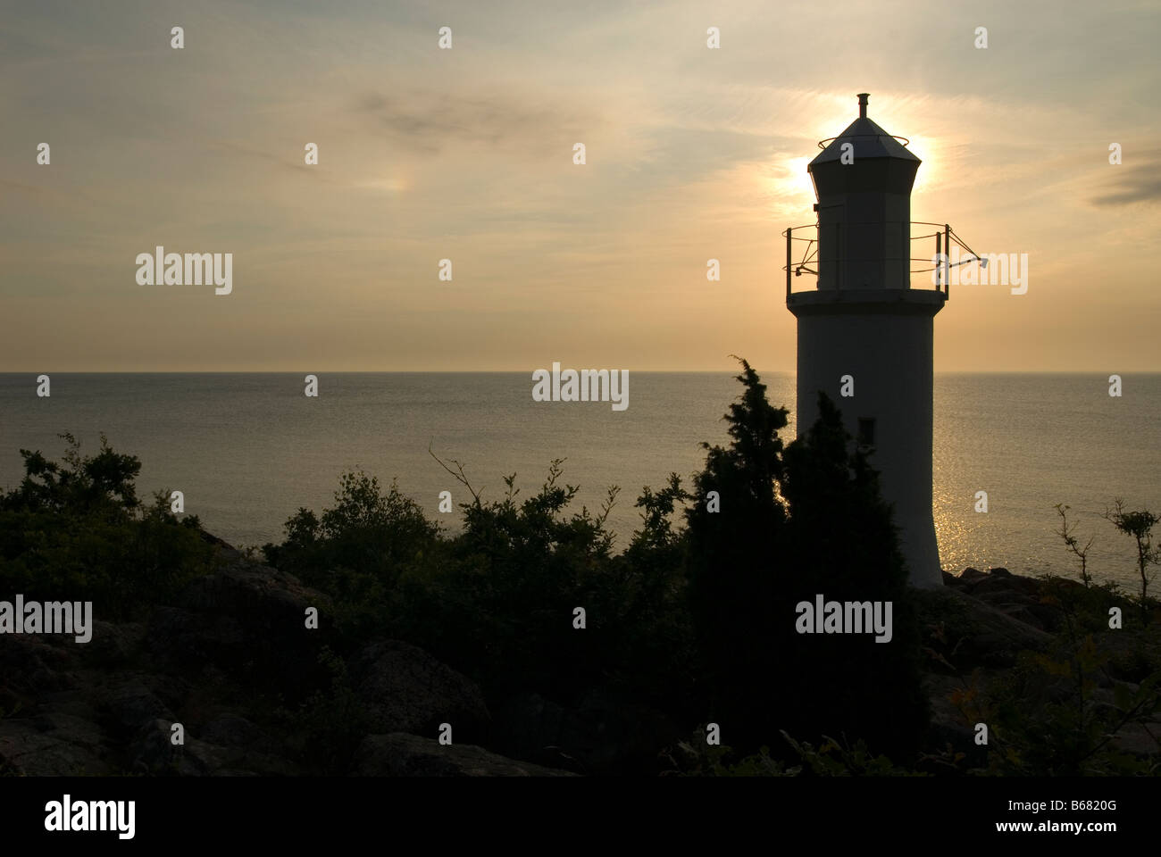 LIghthouse in sunset Stock Photo - Alamy