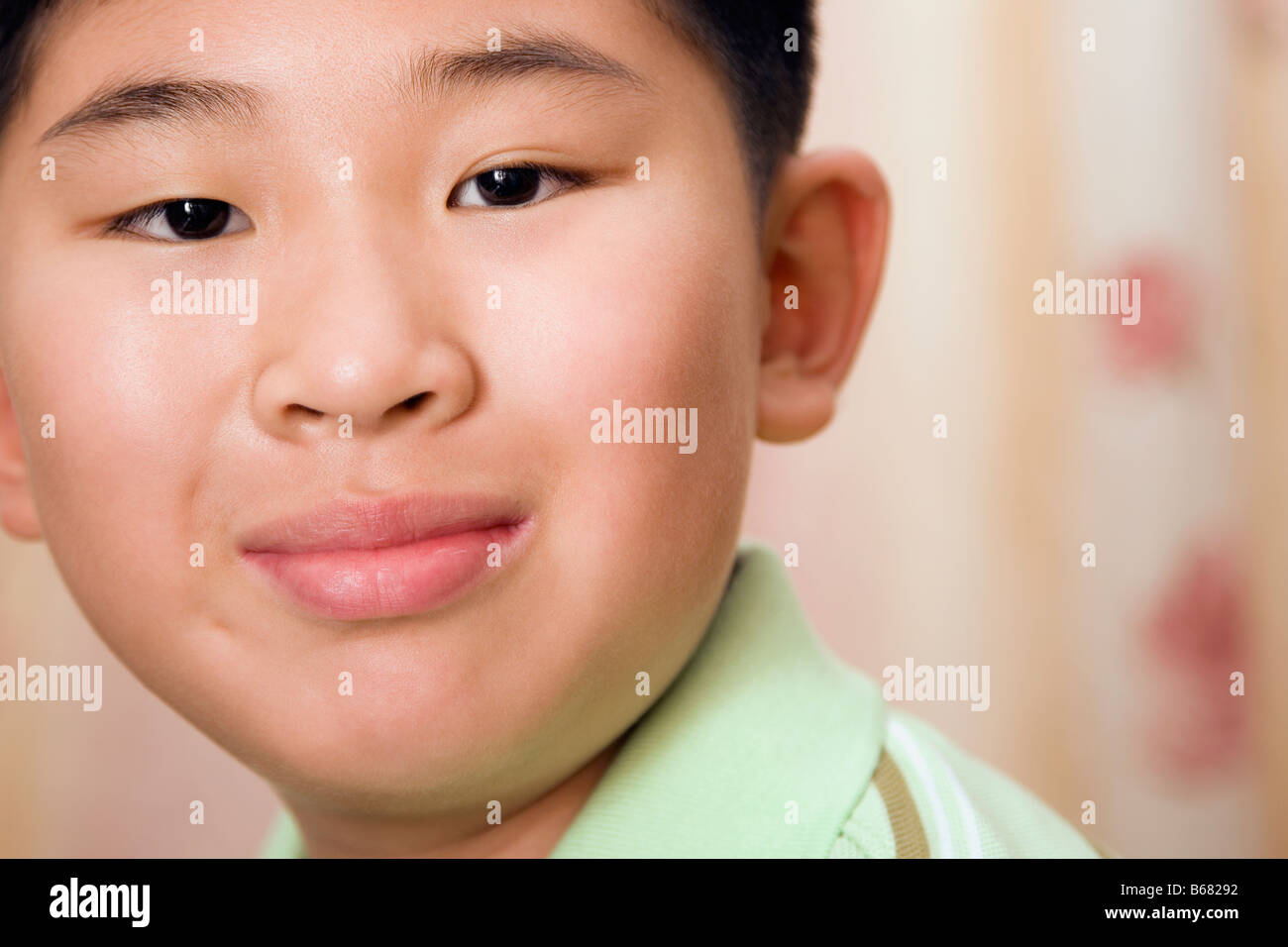 Portrait of a boy smirking Stock Photo - Alamy