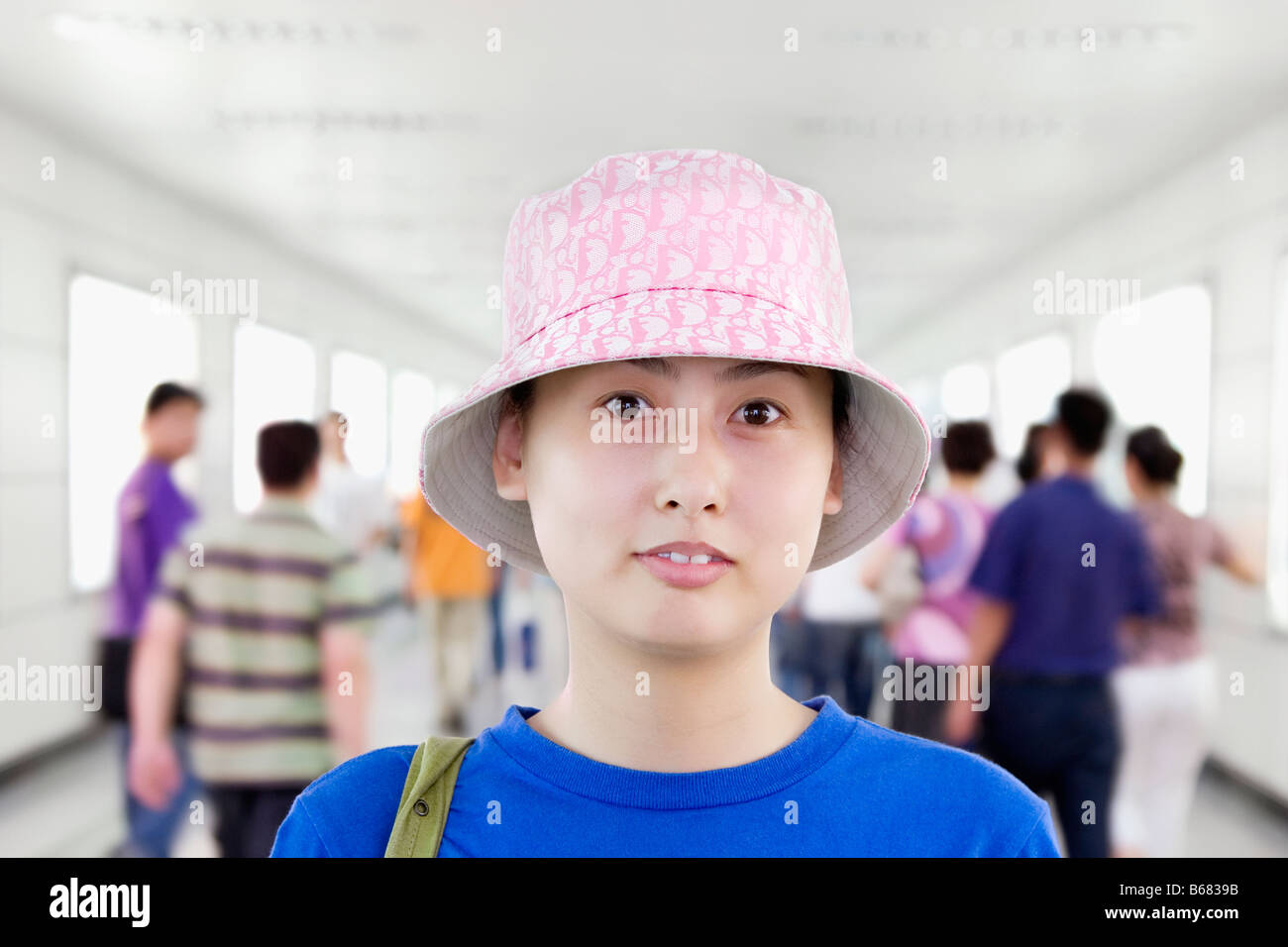 Portrait of a young woman in a corridor Stock Photo - Alamy