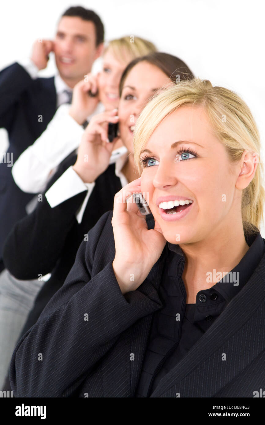 A businesswoman and her three colleagues out of focus behind her all ...