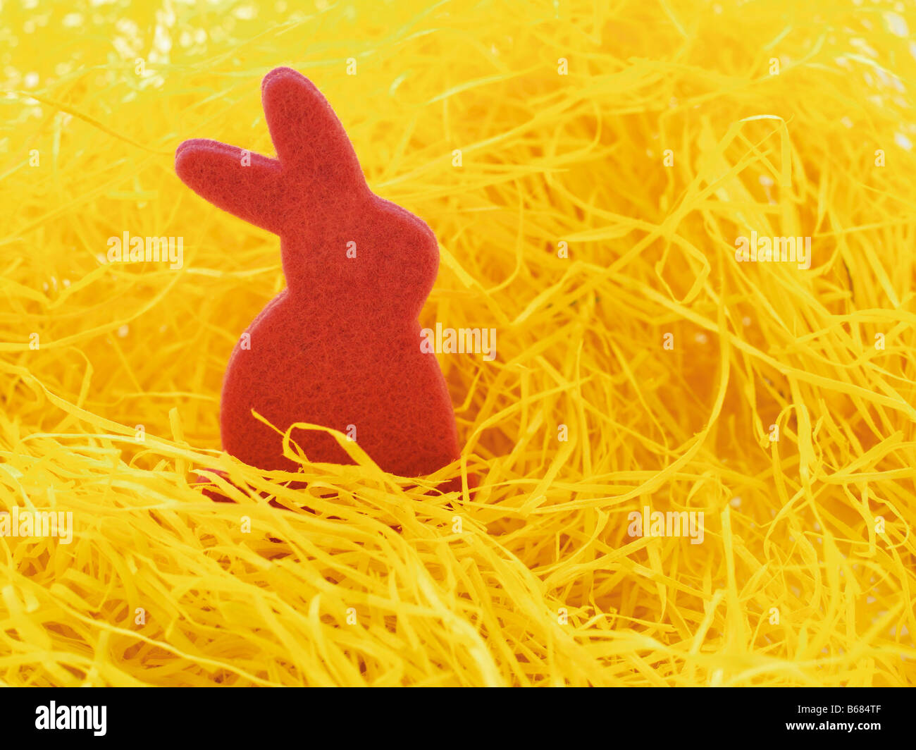 Pink Easter Bunny Sponge in Yellow Straw Stock Photo - Alamy