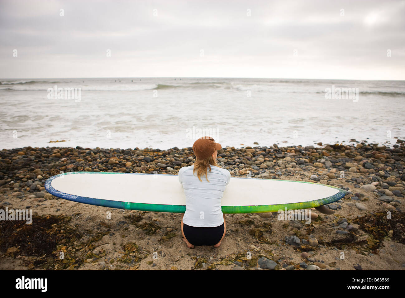 Woman With Surfboard Stock Photo - Alamy