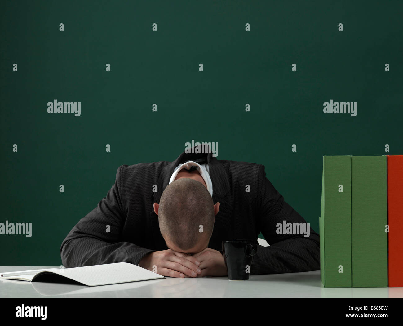 Business man by office table Stock Photo - Alamy