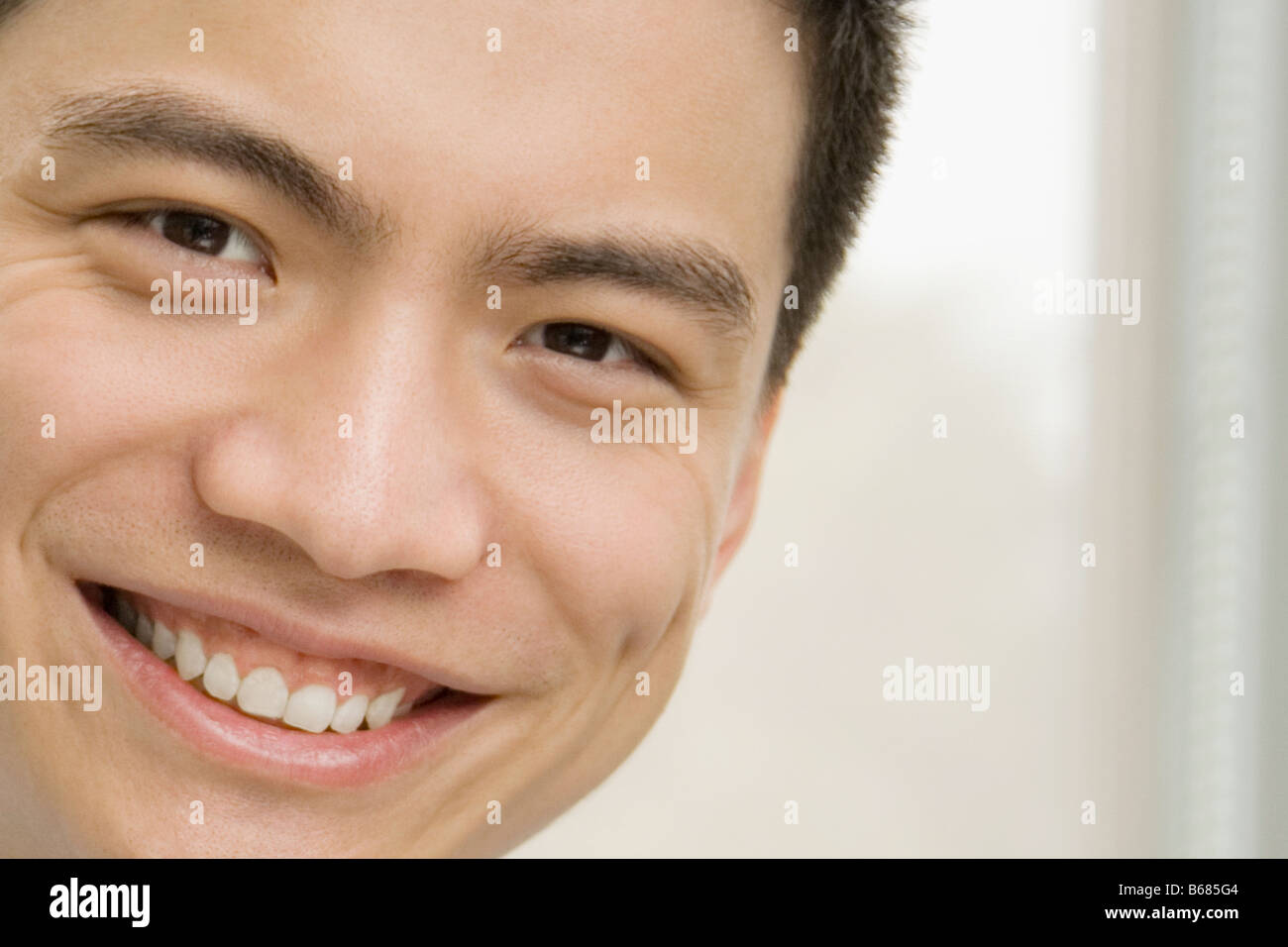 Portrait of a male office worker smiling Stock Photo - Alamy