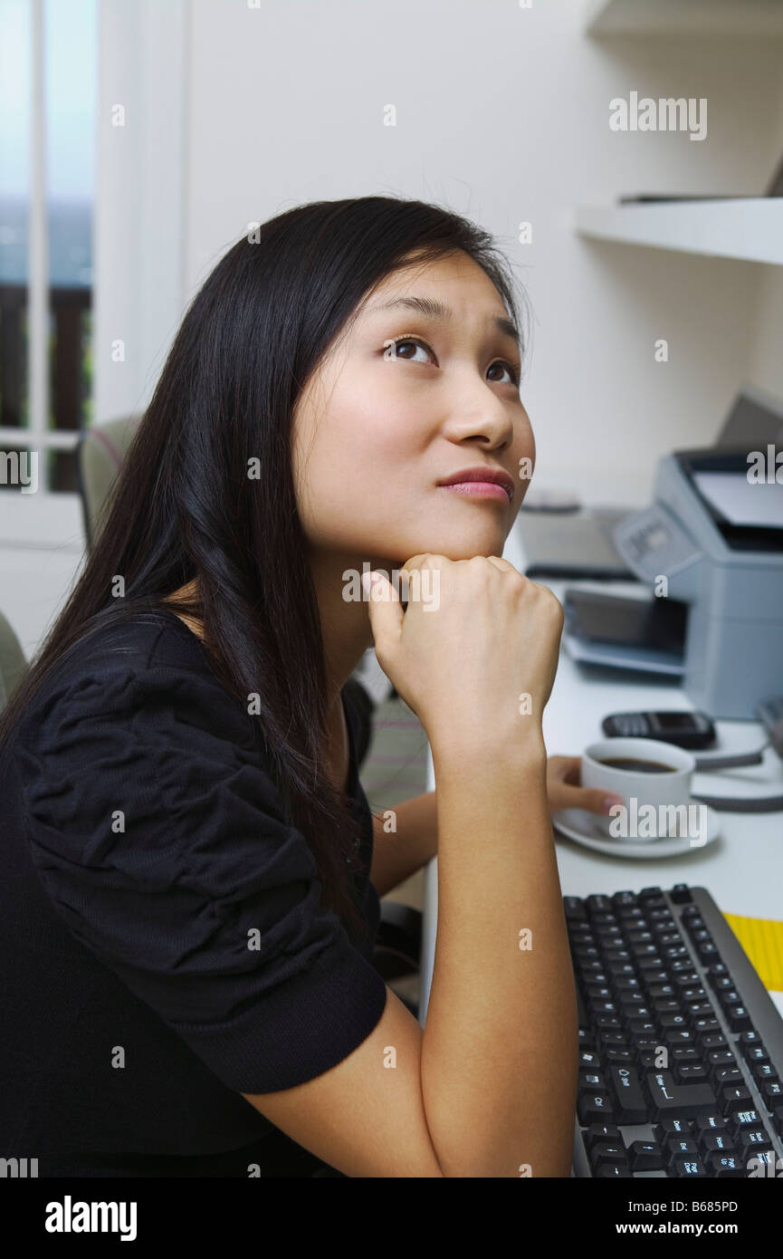 Portrait of Woman Sitting at Desk Stock Photo - Alamy