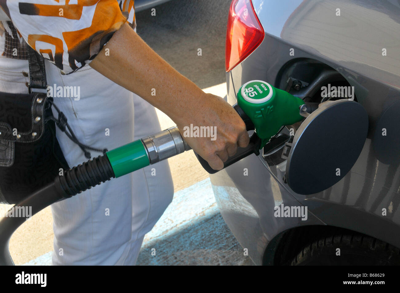 Woman refuels car hi-res stock photography and images - Alamy Woman refuels car hi-res stock photography and images - Alamy