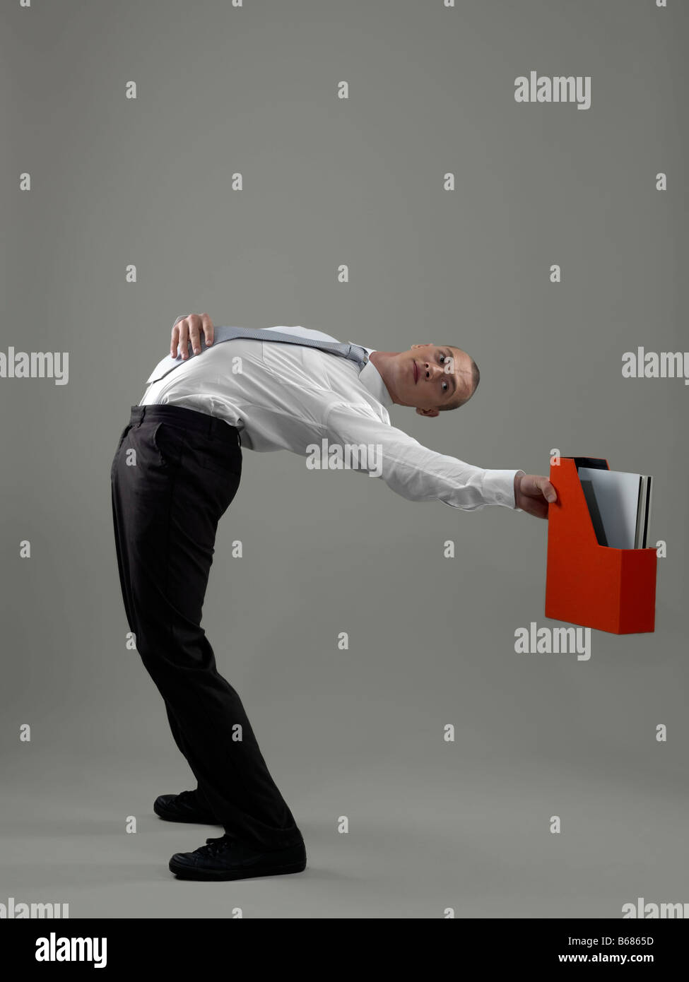 Business man bending over backwards hi-res stock photography and images ...