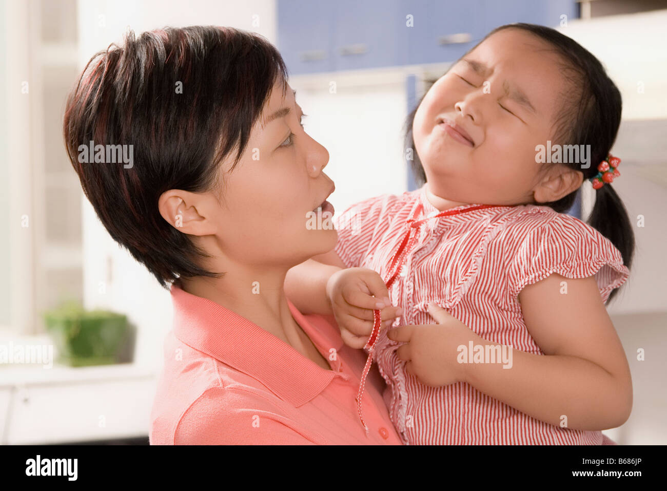 Chinese parents consoling kids hi-res stock photography and images - Alamy