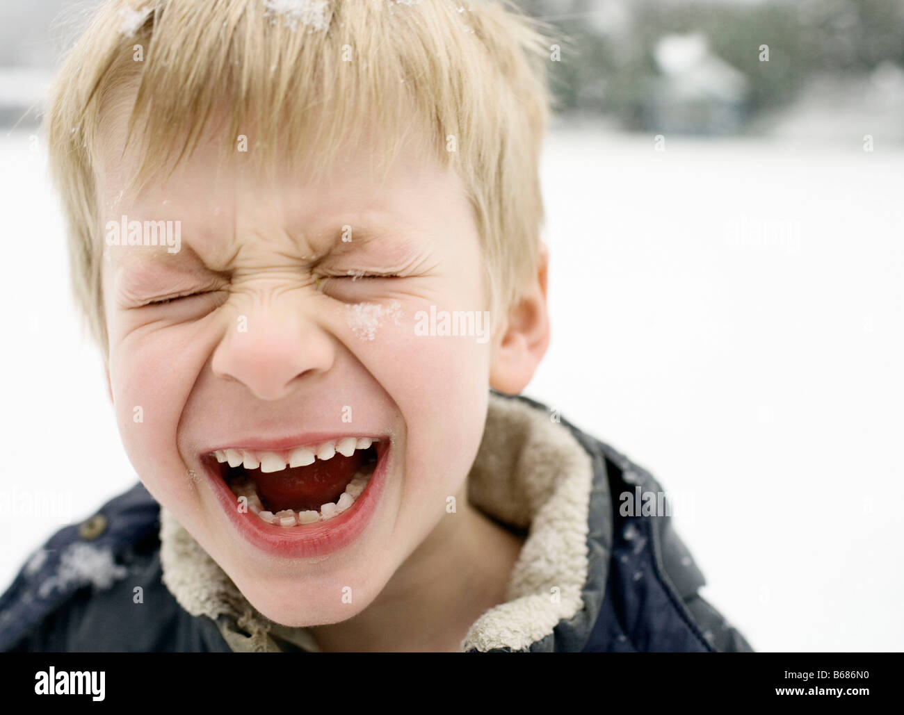 Young boy laughing eyes closed hi-res stock photography and images - Alamy
