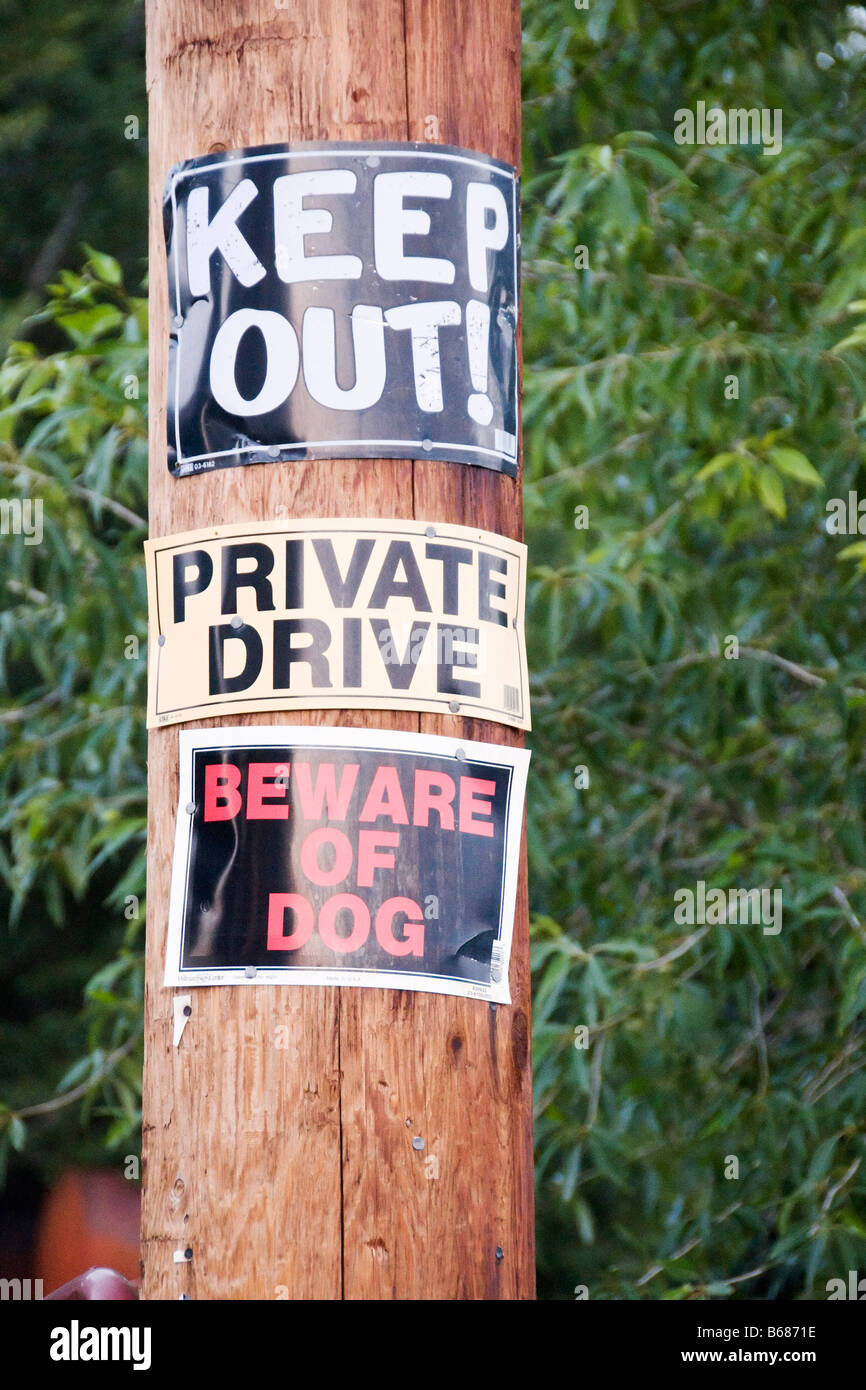 Warning Signs on a Pole Stock Photo - Alamy