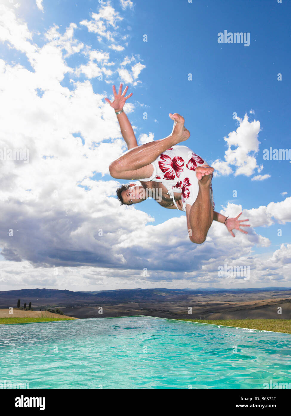 Man jumping in swimming pool Stock Photo - Alamy