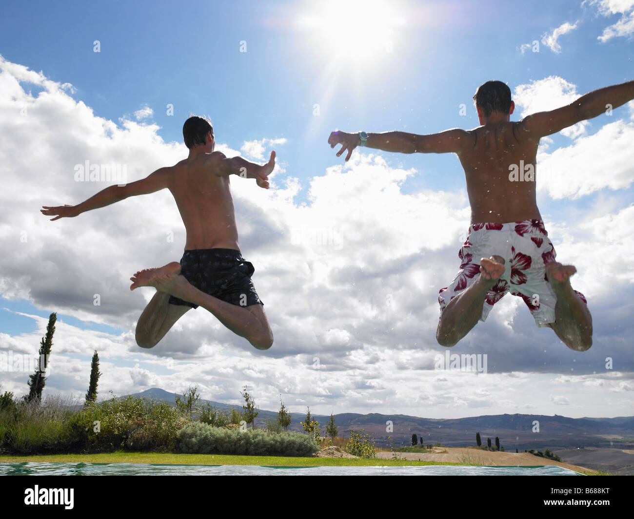 Man jumping in swimming pool Stock Photo - Alamy