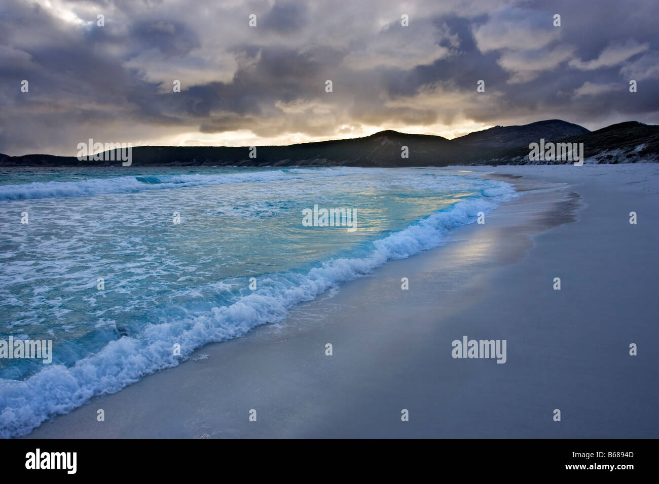 A wave breaking on Hellfire Bay at sunset. Cape Le Grand National Park ...