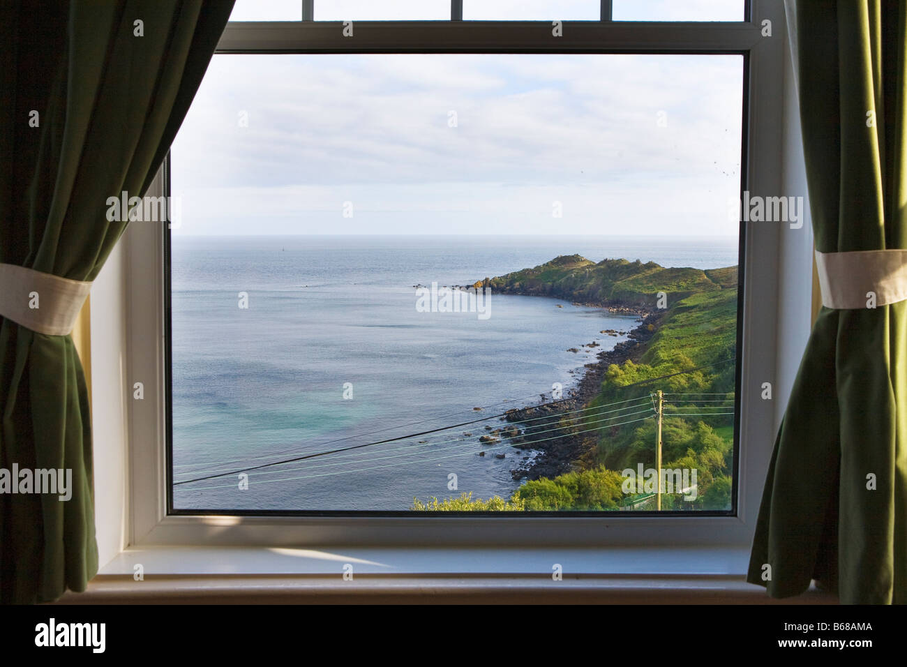 View from a window of the peninsula at Coverack on the coast of ...