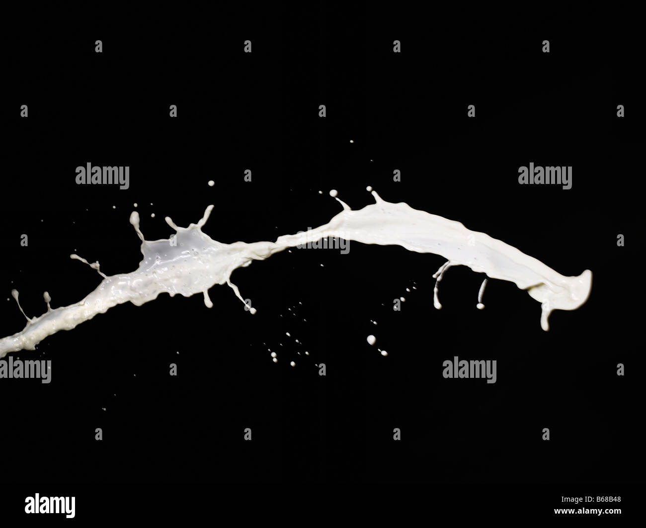 White liquid falling, slow motion Stock Photo - Alamy