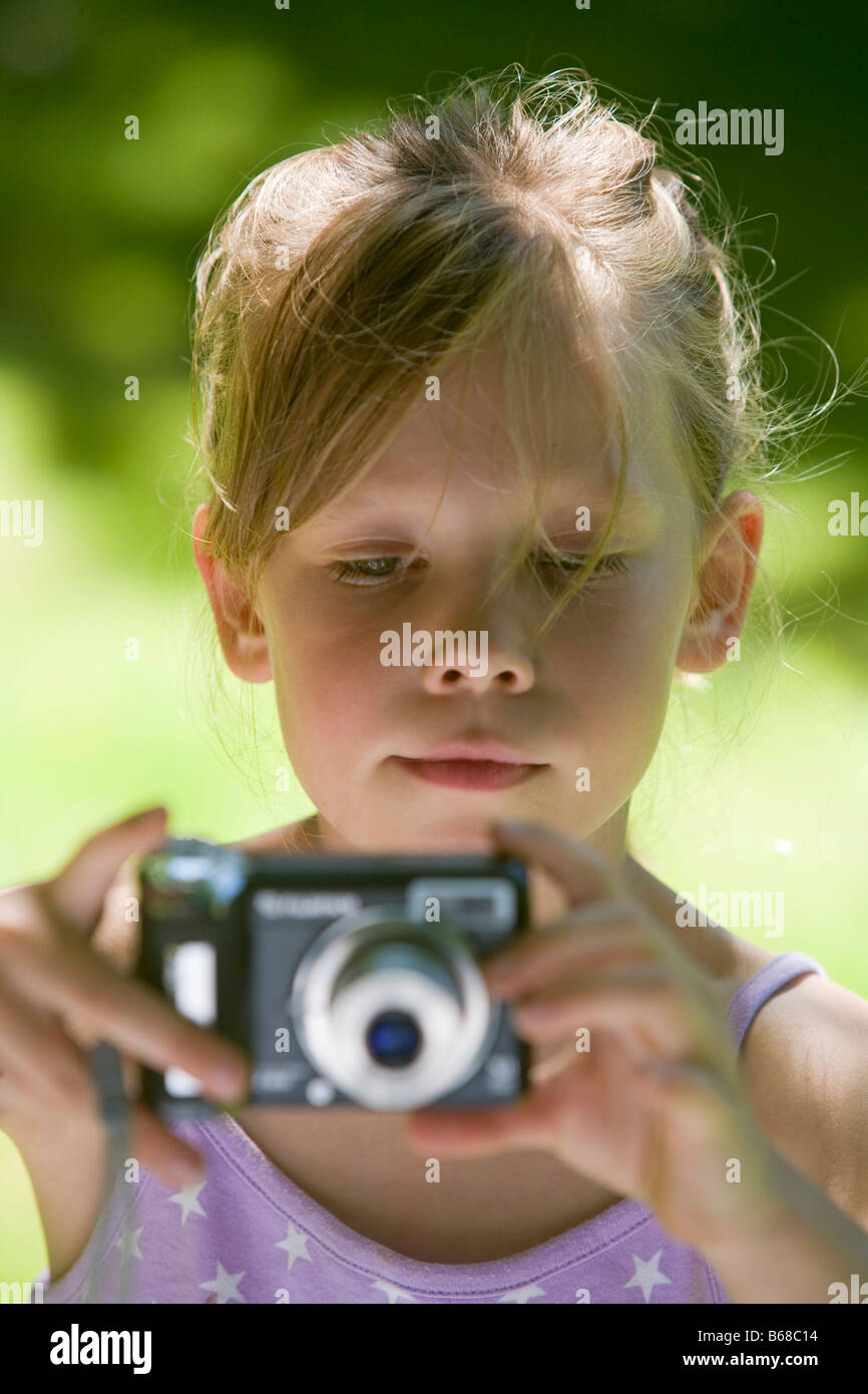 Young girl using digital camera Stock Photo - Alamy
