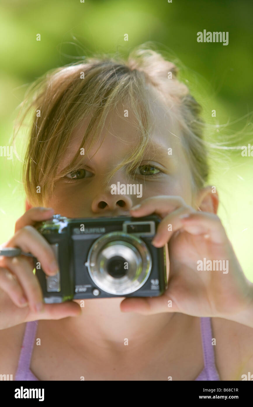 Young girl using digital camera Stock Photo - Alamy
