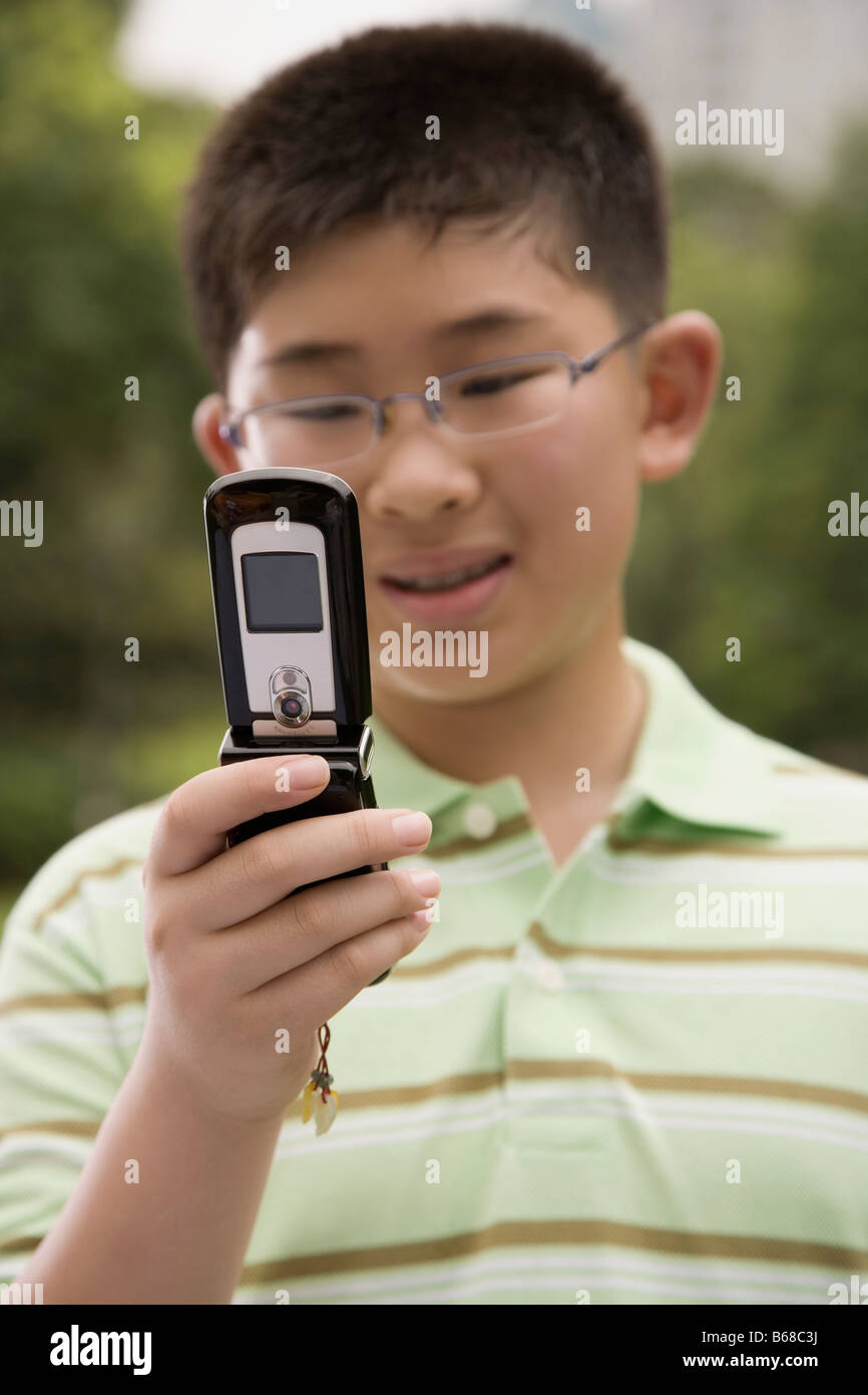 Close-up of a boy using a mobile phone Stock Photo - Alamy