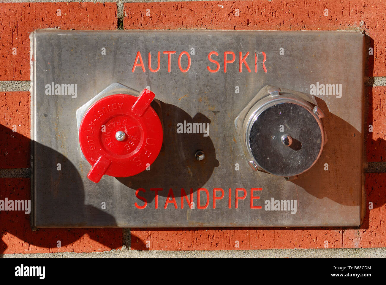 fire water gate on a brick wall downtown stand pipe security fire ...