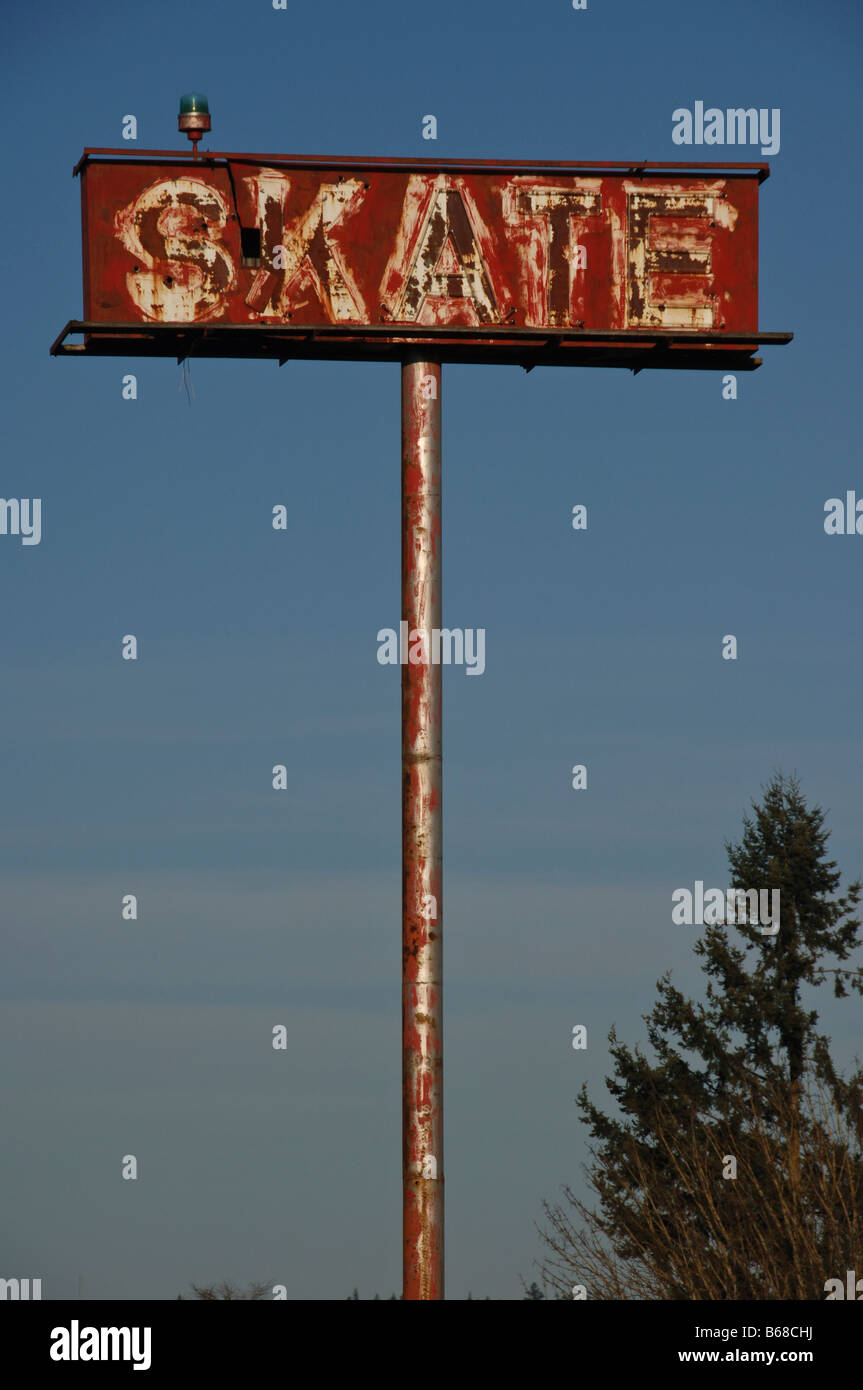 Old sign advertising a skating rink Stock Photo - Alamy
