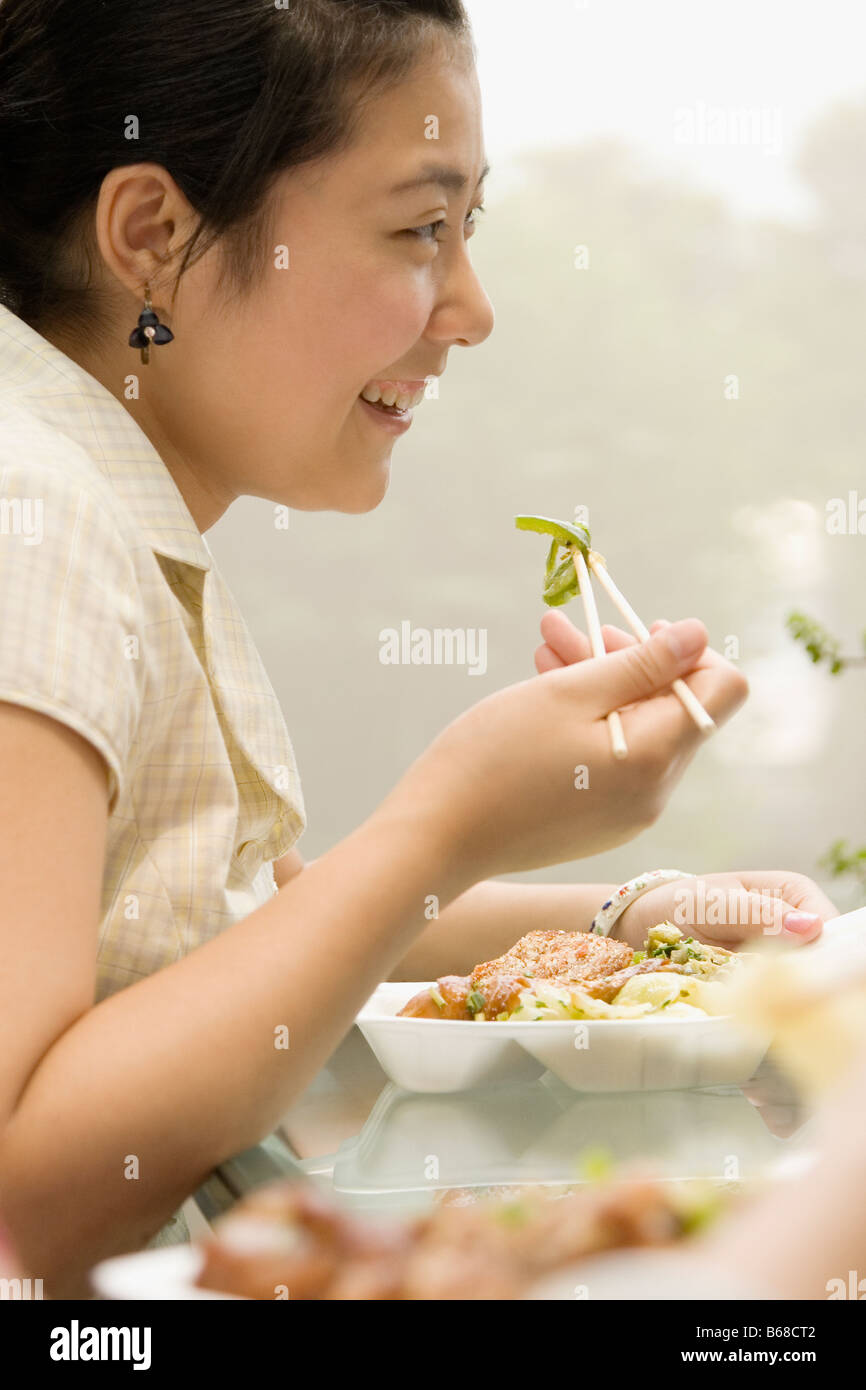 Side profile of a female office worker having lunch and smiling Stock ...