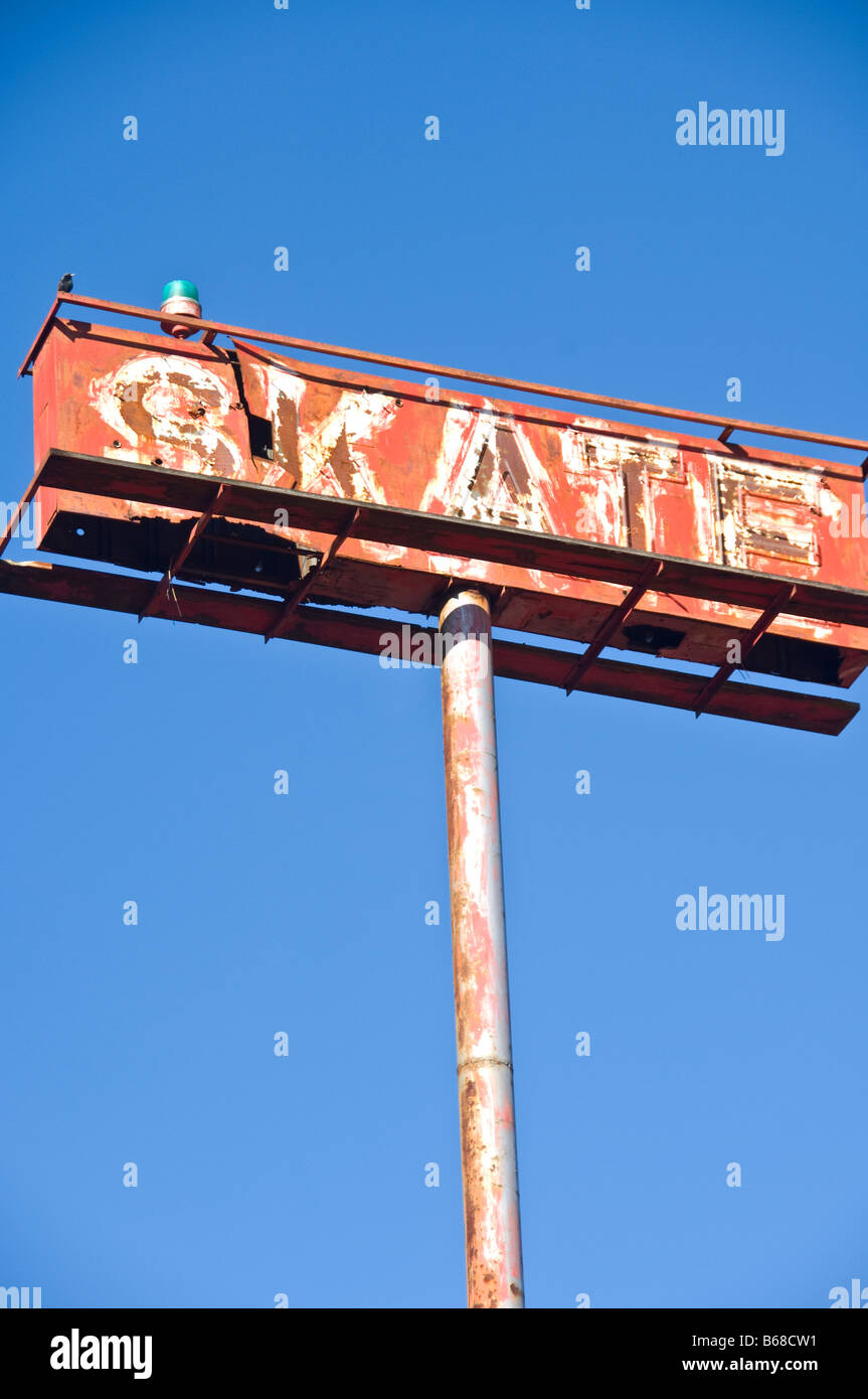 Old sign advertising a skating rink Stock Photo - Alamy