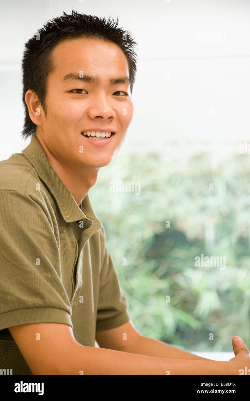 Portrait of a male office worker smiling Stock Photo - Alamy