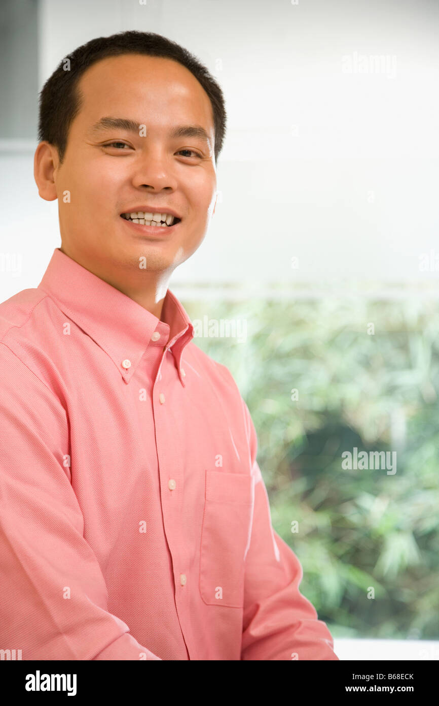 Portrait of a male office worker smiling Stock Photo - Alamy