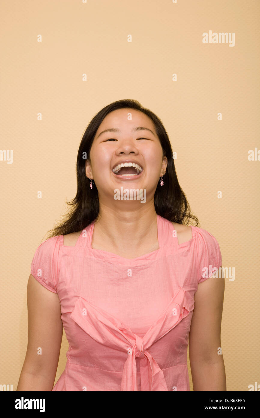 Close-up of a young woman laughing Stock Photo - Alamy