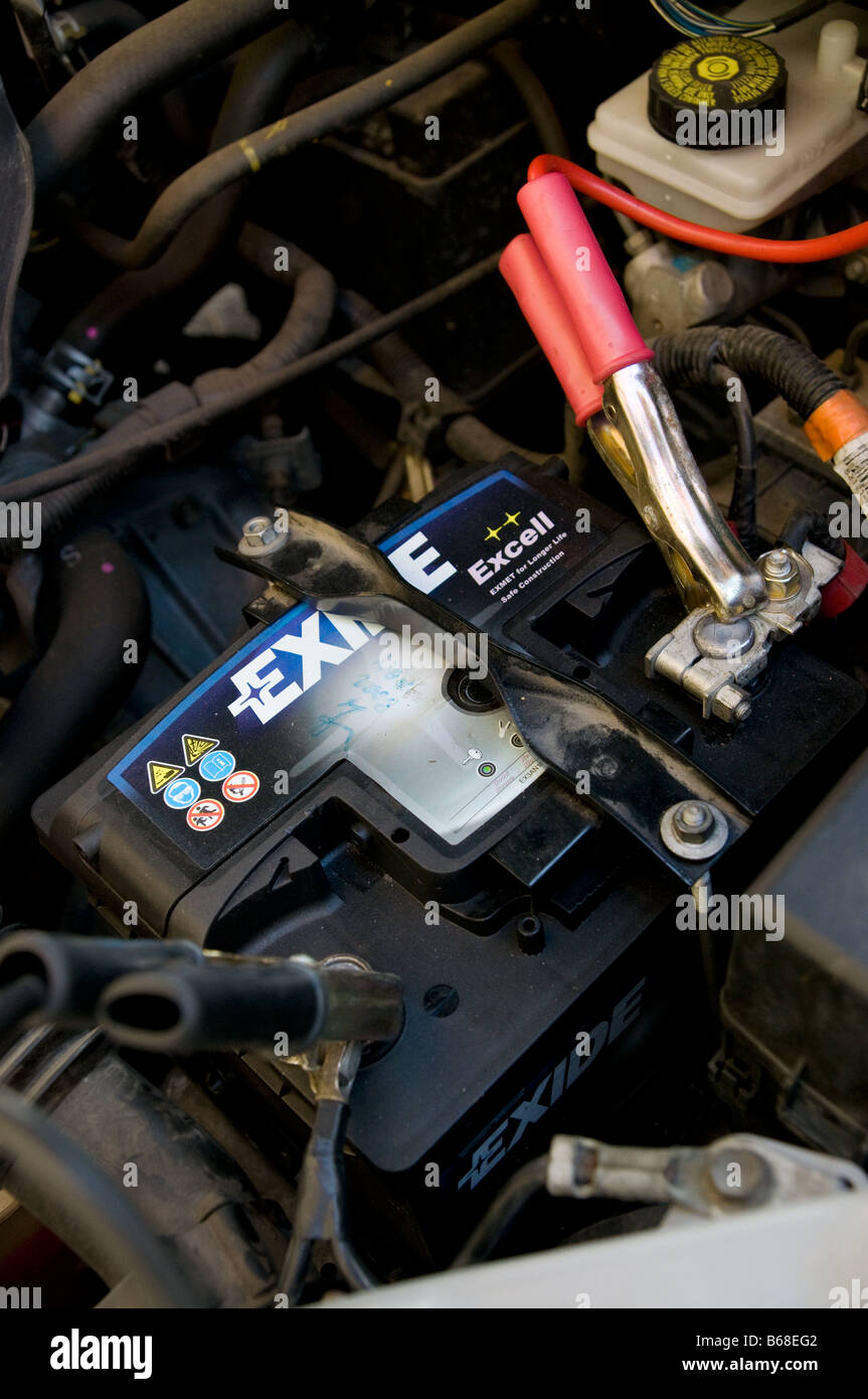 Car battery with cables connected to it for recharging Stock Photo - Alamy