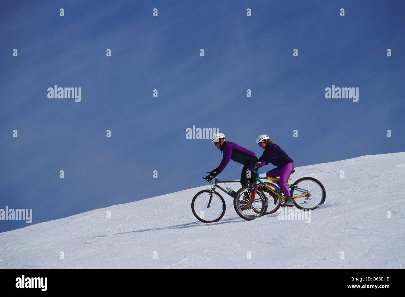 Mountain biking on snow Stock Photo - Alamy