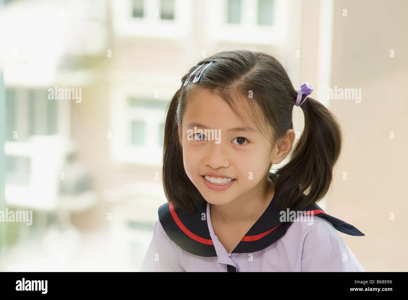 Portrait of a schoolgirl smiling Stock Photo - Alamy
