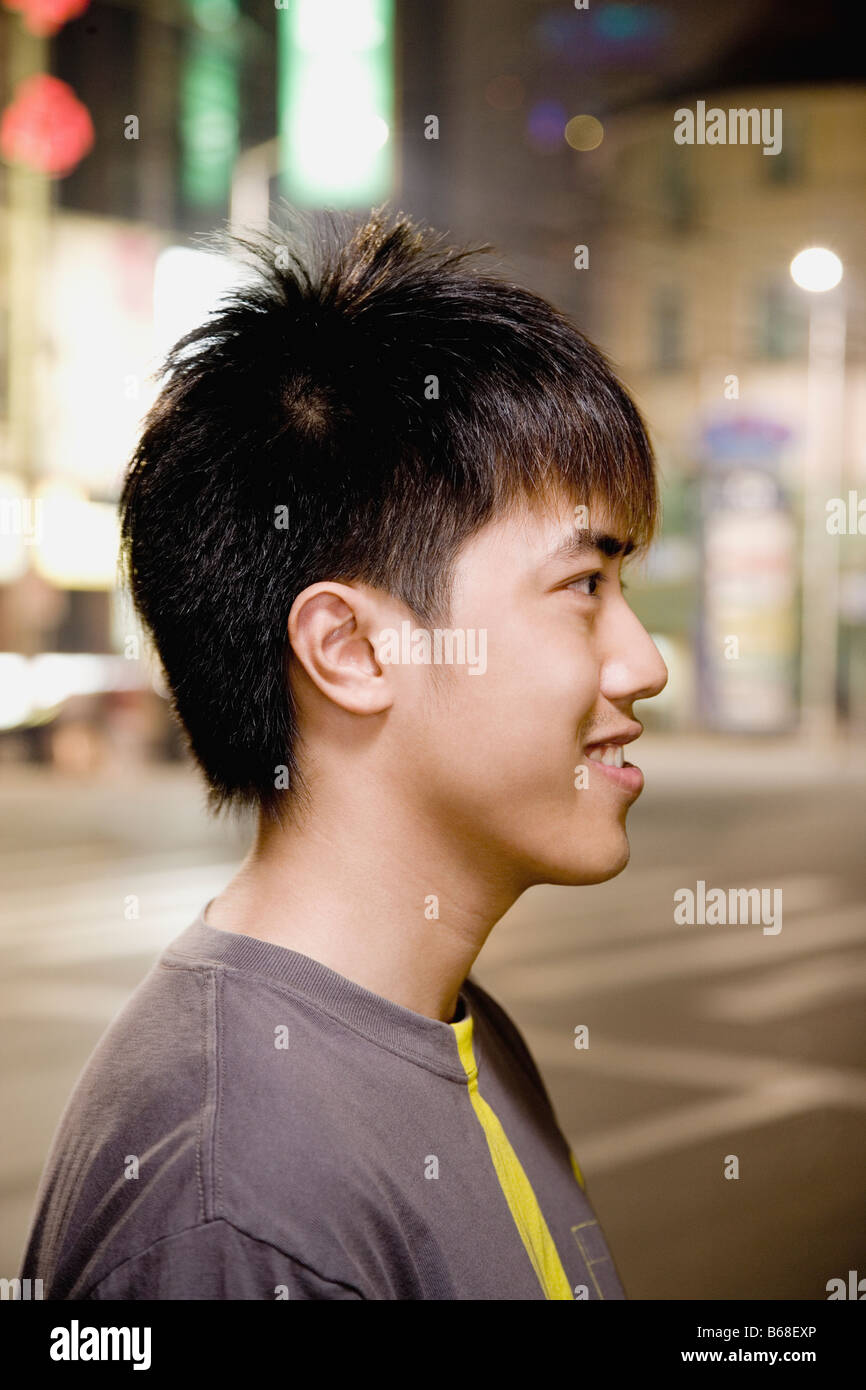 Side profile of a young man smiling Stock Photo - Alamy