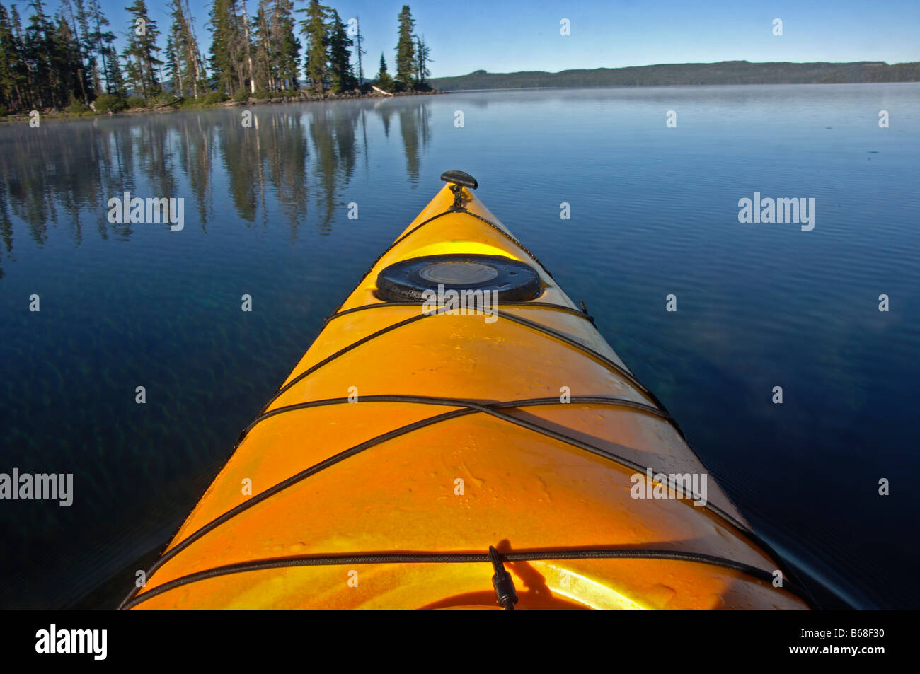 Prow of a yellow kayak Stock Photo - Alamy