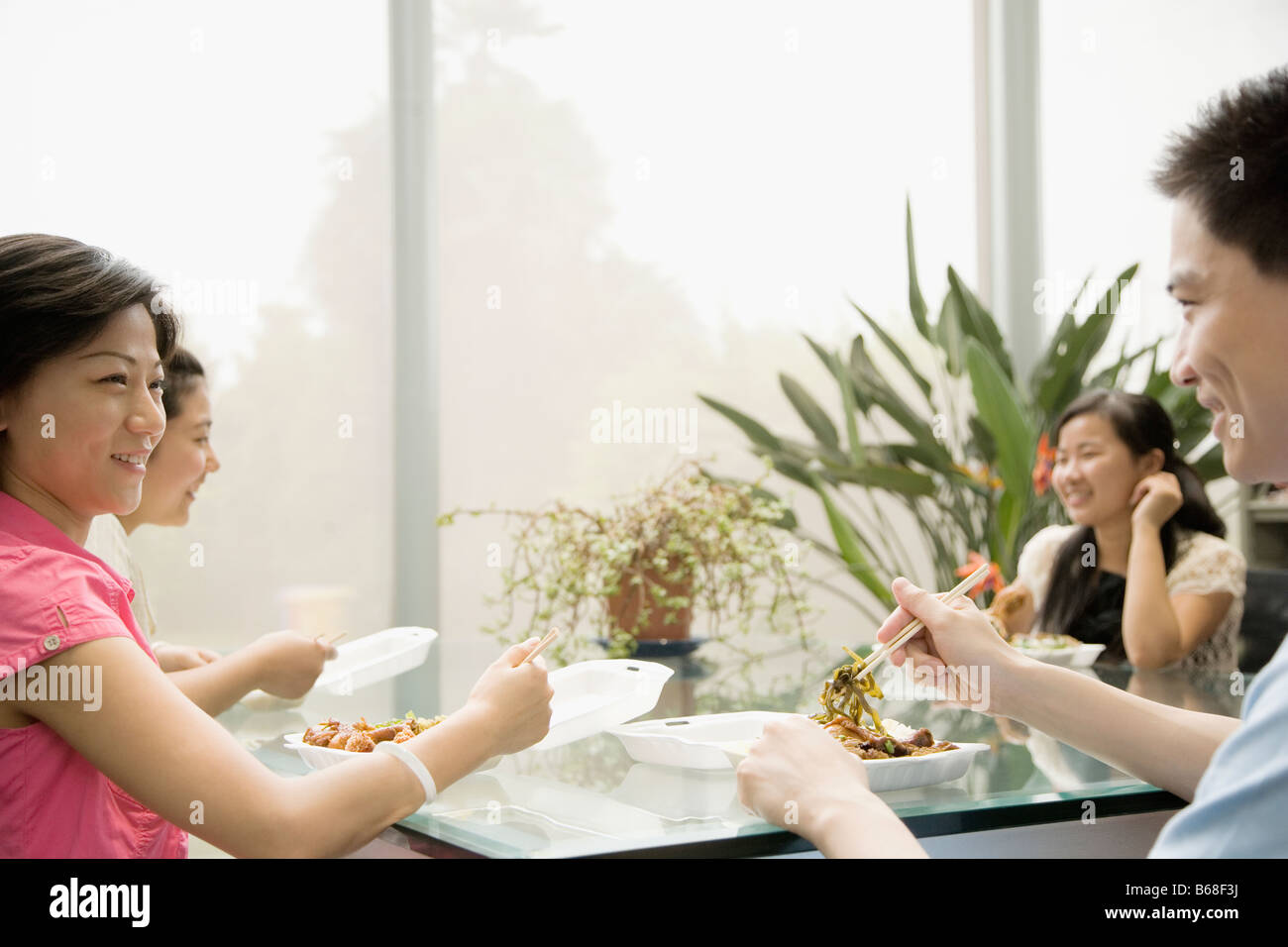 Four office workers having lunch Stock Photo - Alamy