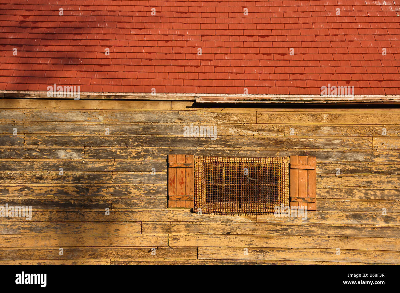 Old building with red roof and yellow walls Stock Photo - Alamy