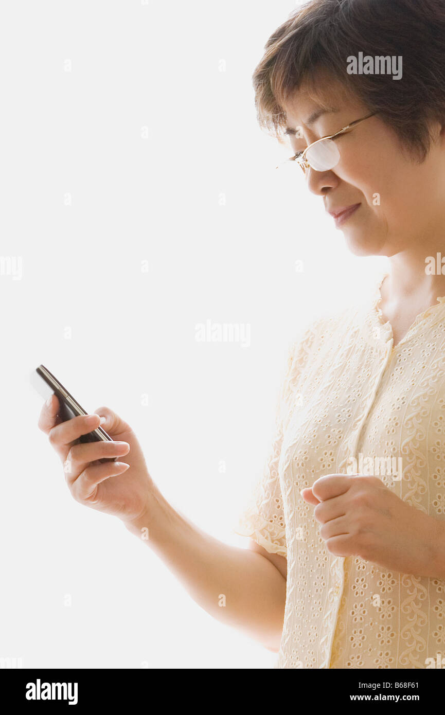 Close-up of a mature woman text messaging Stock Photo - Alamy